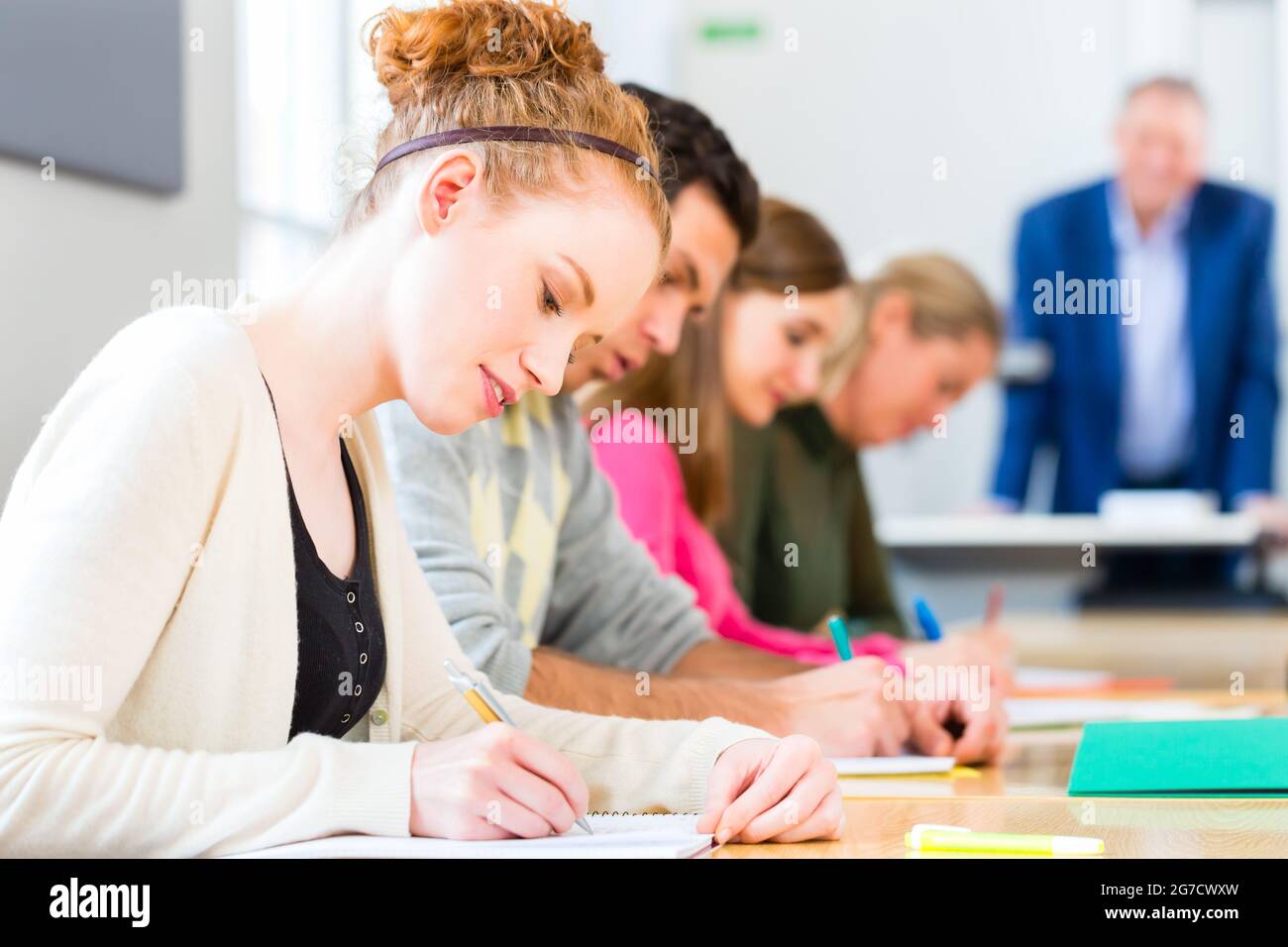 University college students writing test or exam Stock Photo - Alamy