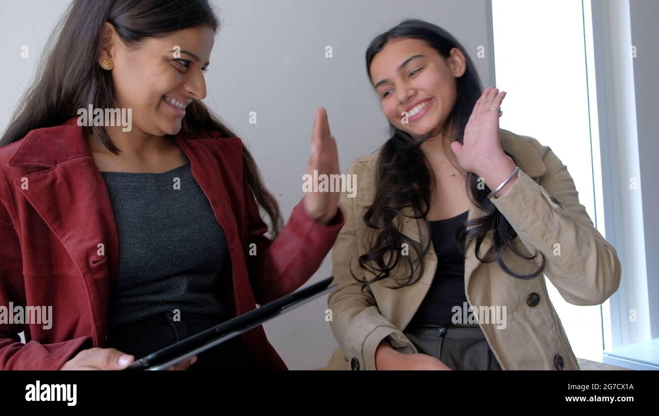 Girls High Fiving High Resolution Stock Photography and Images - Alamy