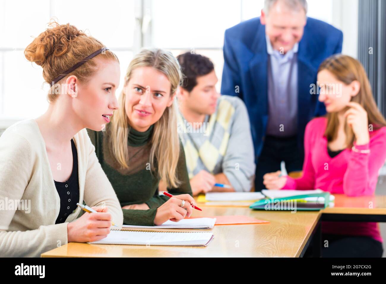 University college students using laptop for project team work Stock ...