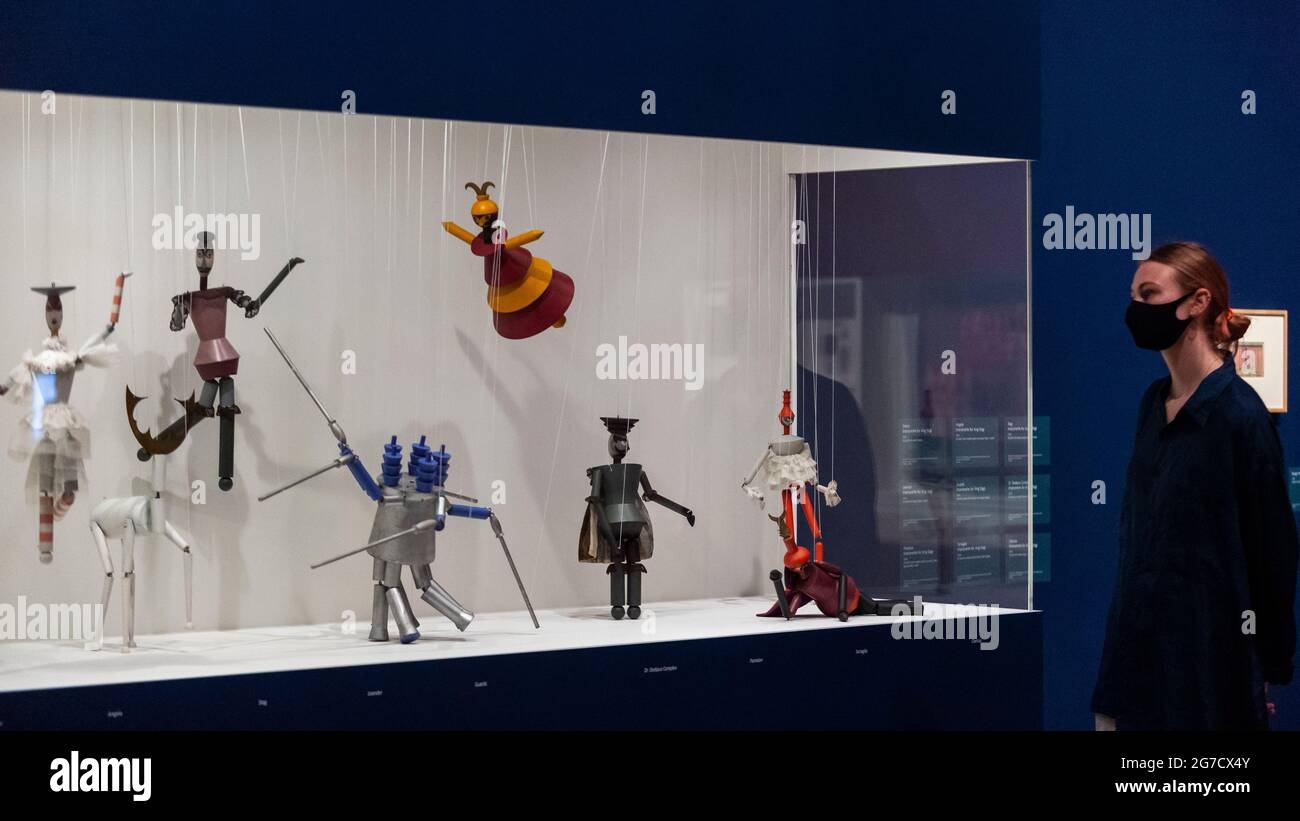 London, UK. 13 July 2021. A staff member views some of the 17 string ...