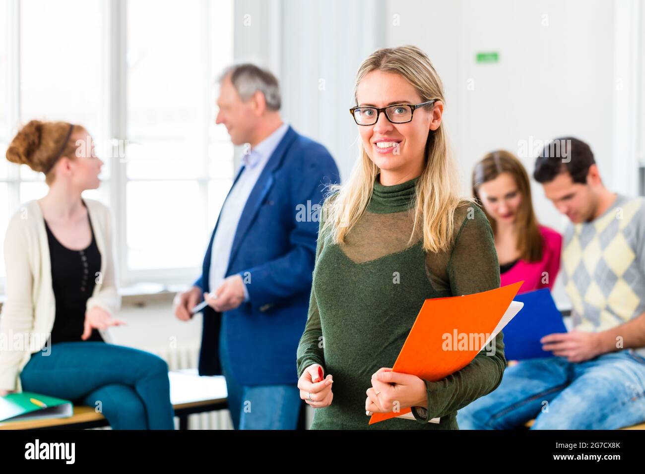 University college student standing in class room Stock Photo - Alamy
