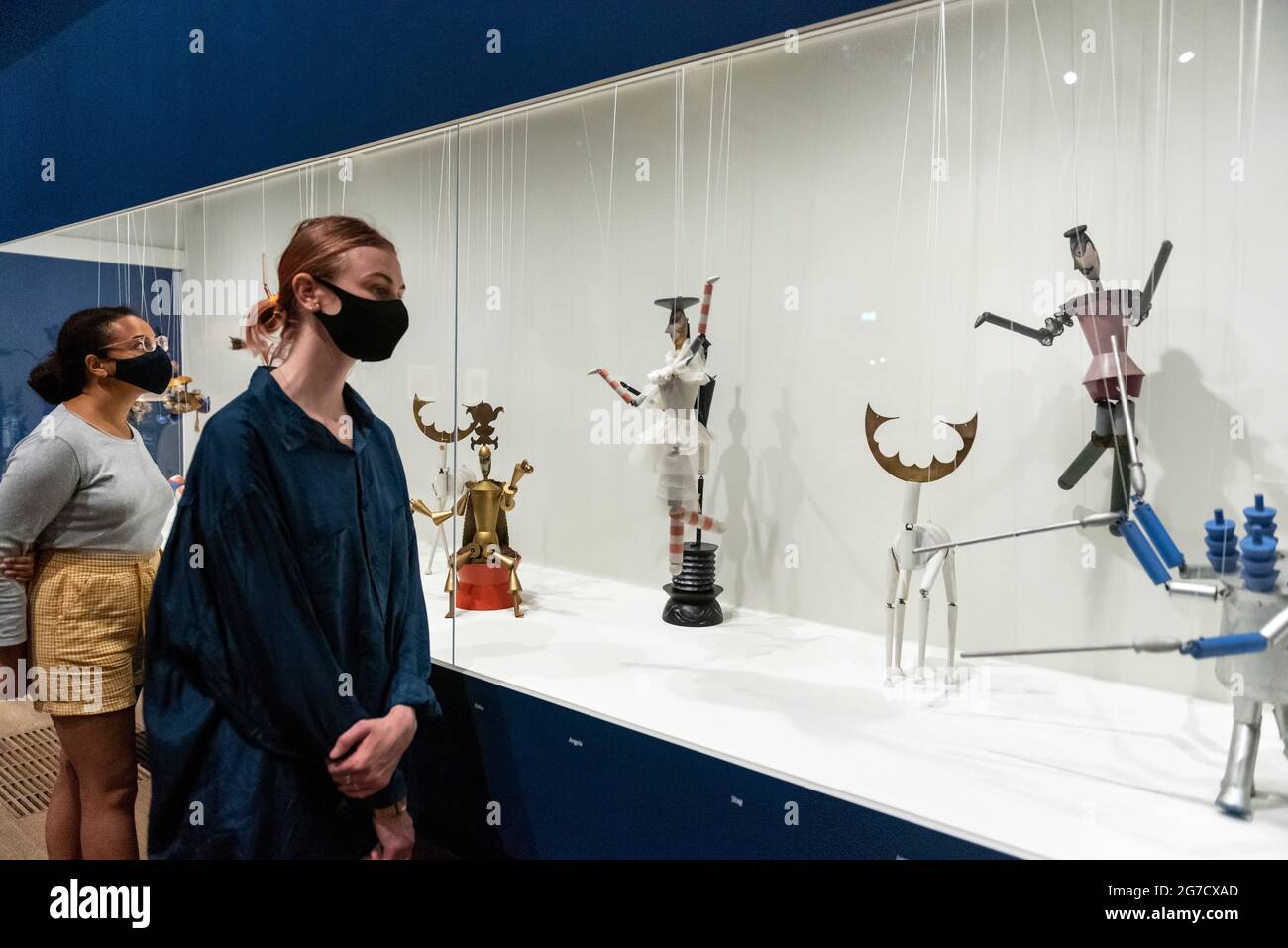 London, UK. 13 July 2021. A staff member views some of the 17 string ...