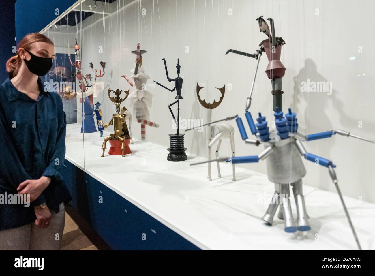 London, UK. 13 July 2021. A staff member views some of the 17 string ...