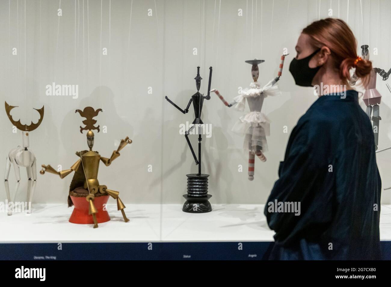 London, UK. 13 July 2021. A staff member views some of the 17 string ...