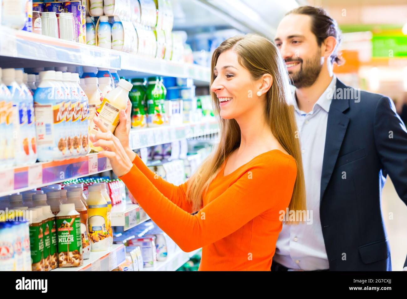 Woman selecting fruits while grocery shopping in supermarket Stock ...