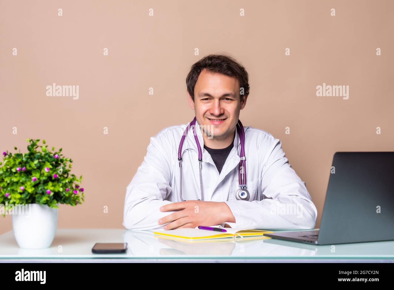 Cheerful medical nurse sitting hi-res stock photography and images - Alamy