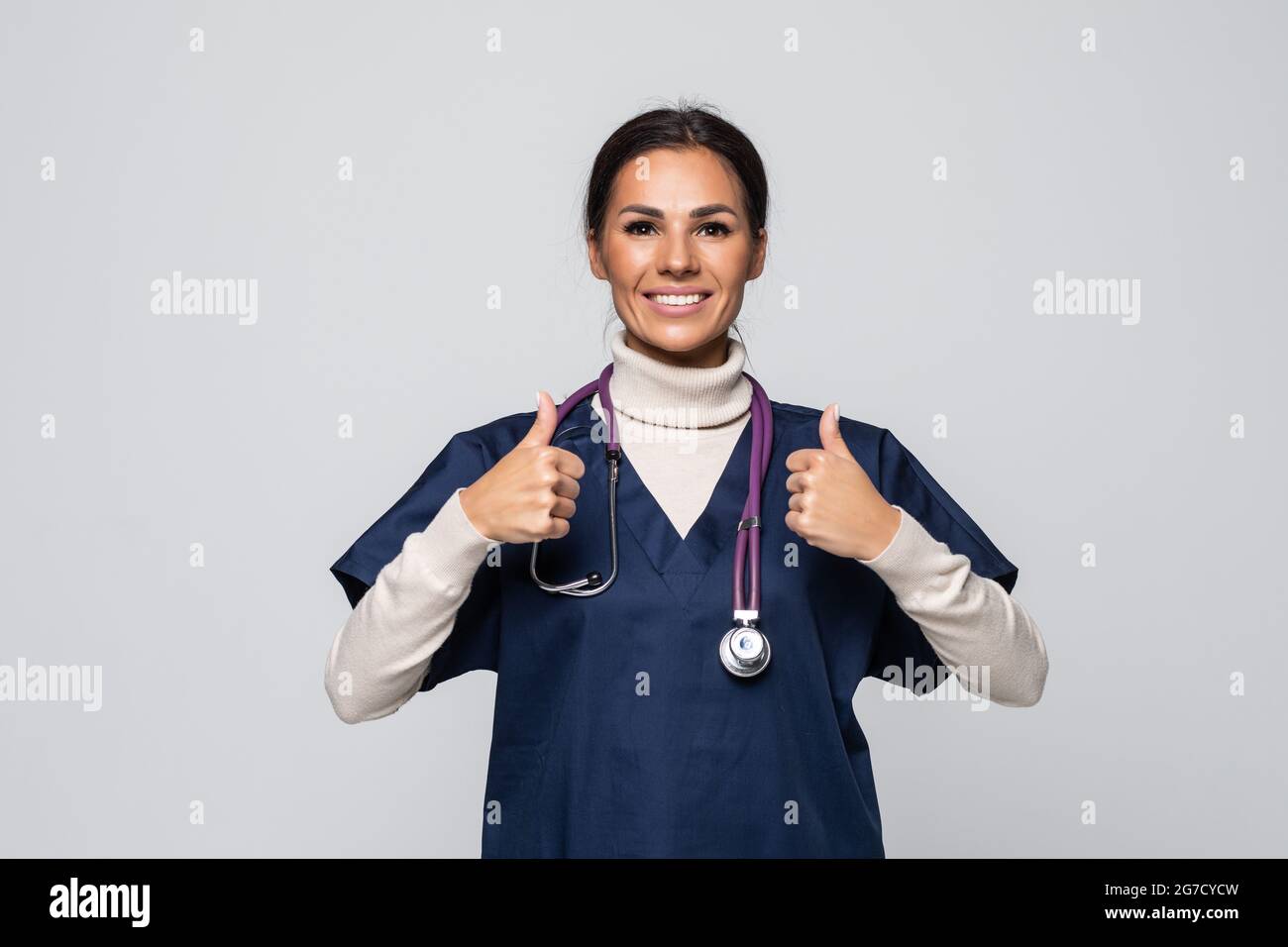 Happy doctor with thumb up, isolated on white Stock Photo - Alamy