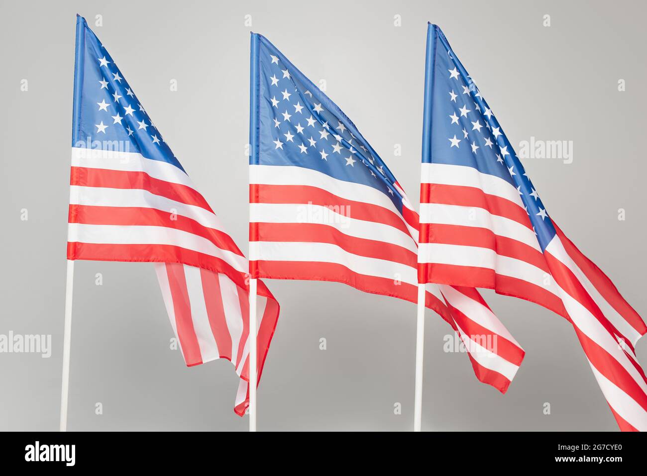 red and blue american flags with stars and stripes isolated on grey ...