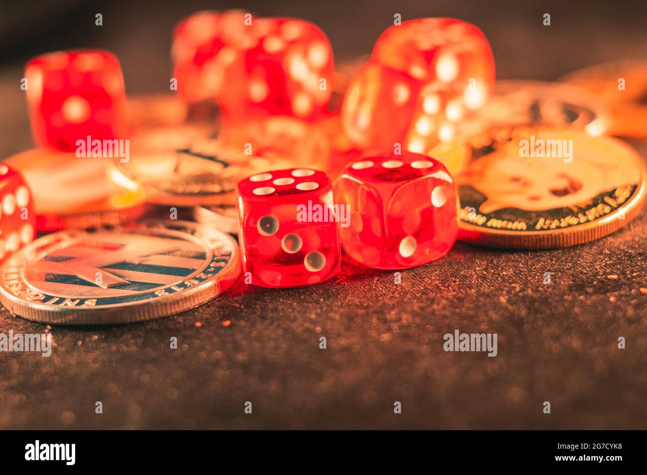 Pile of red dices and gold coins Stock Photo - Alamy