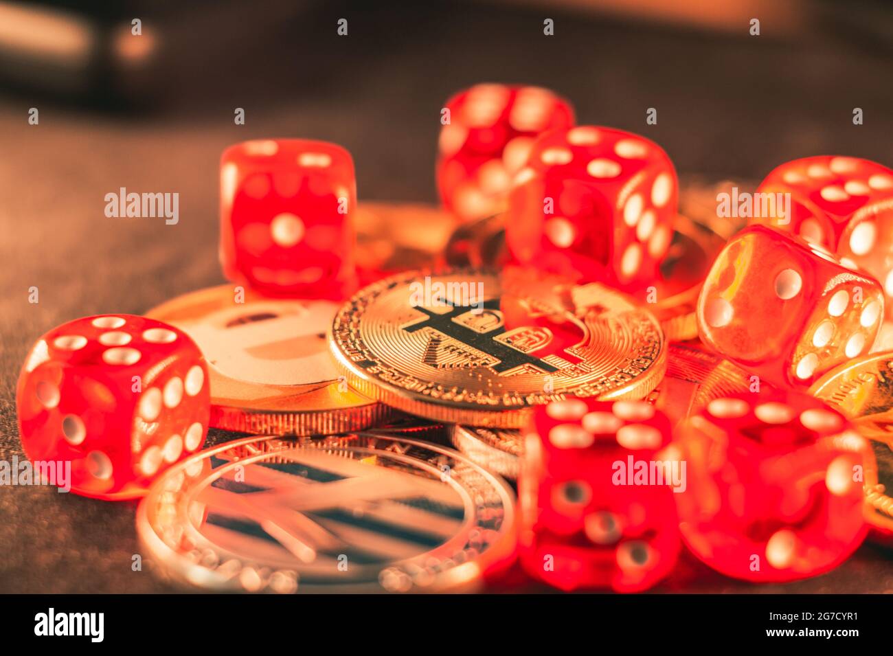 Pile of red dices and gold coins Stock Photo - Alamy