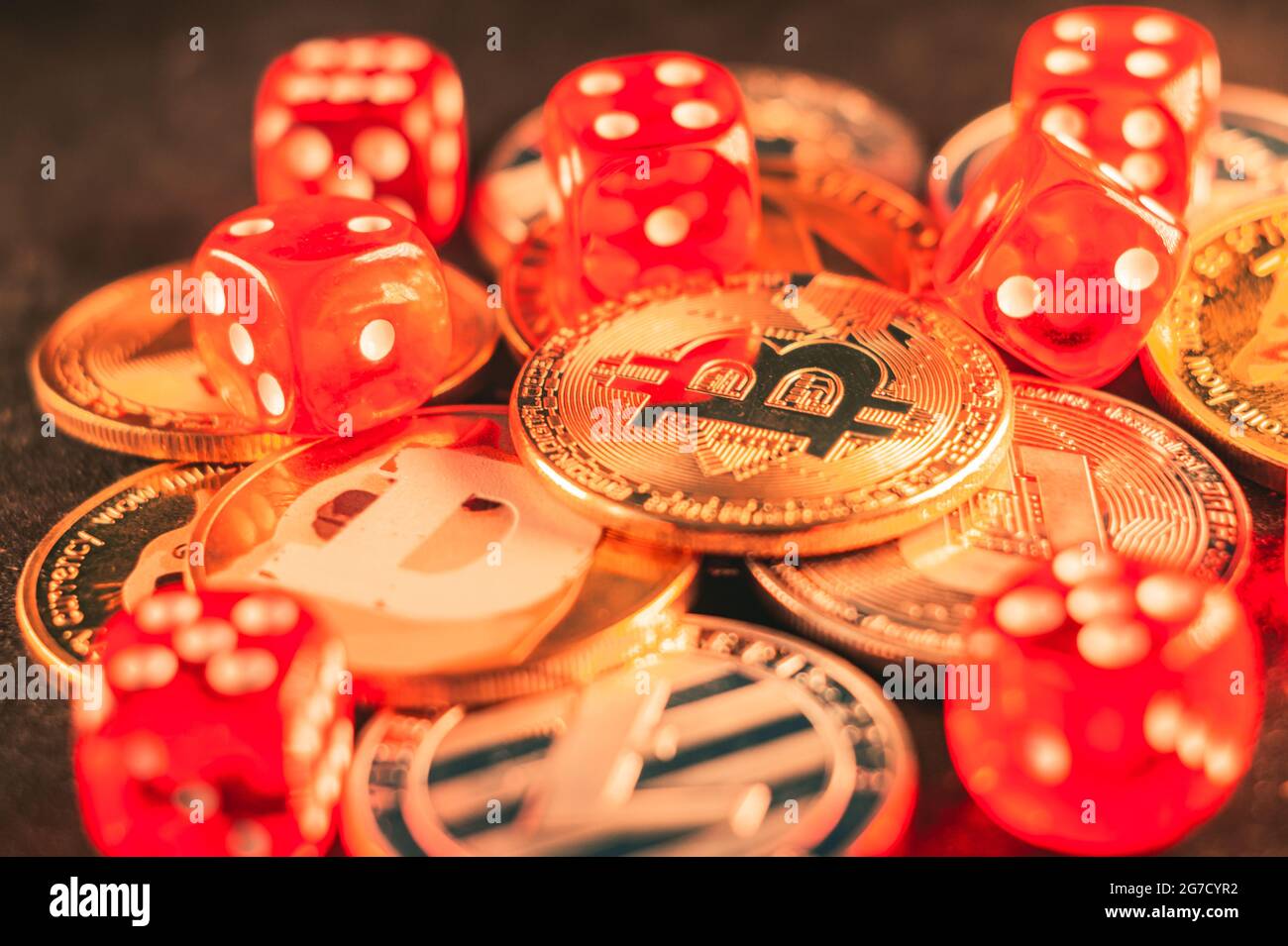 Pile of red dices and gold coins Stock Photo - Alamy