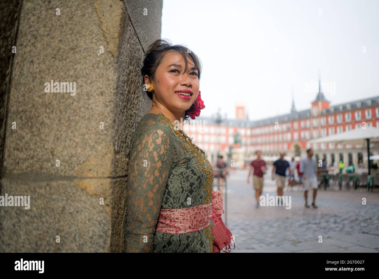 young happy and beautiful Asian woman wearing traditional Balinese ...