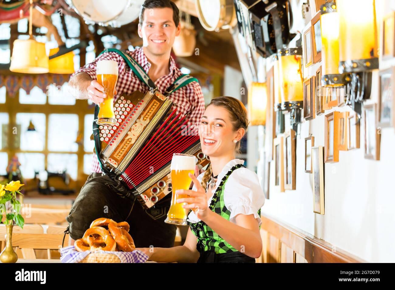 Bavarian restaurant with music, guests, wheat beer and pretzels Stock ...
