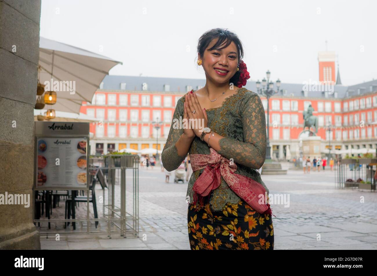 young happy and beautiful Asian woman wearing traditional Balinese ...