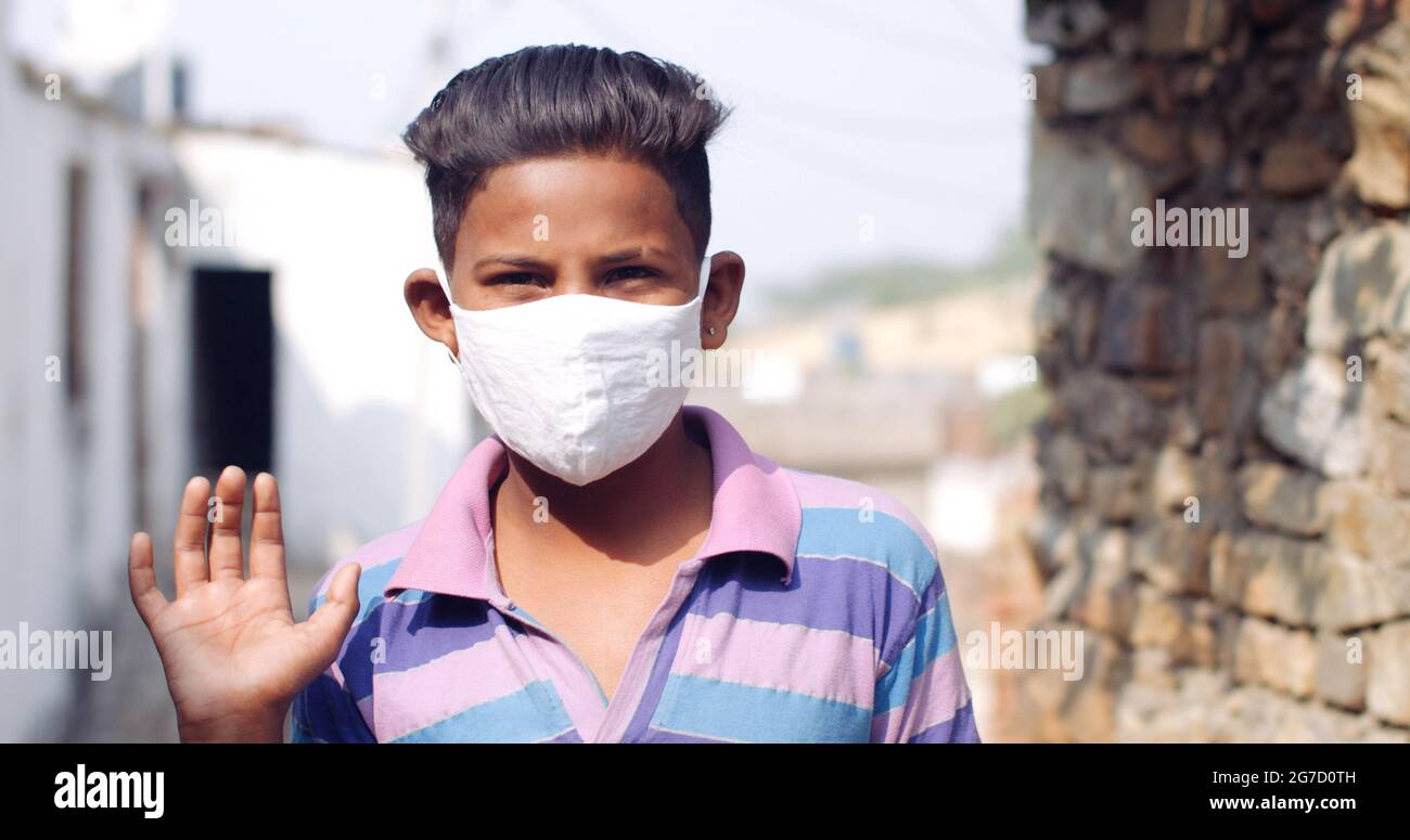 Closeup shot of an Indian boy wearing a mask- new normal concept Stock ...