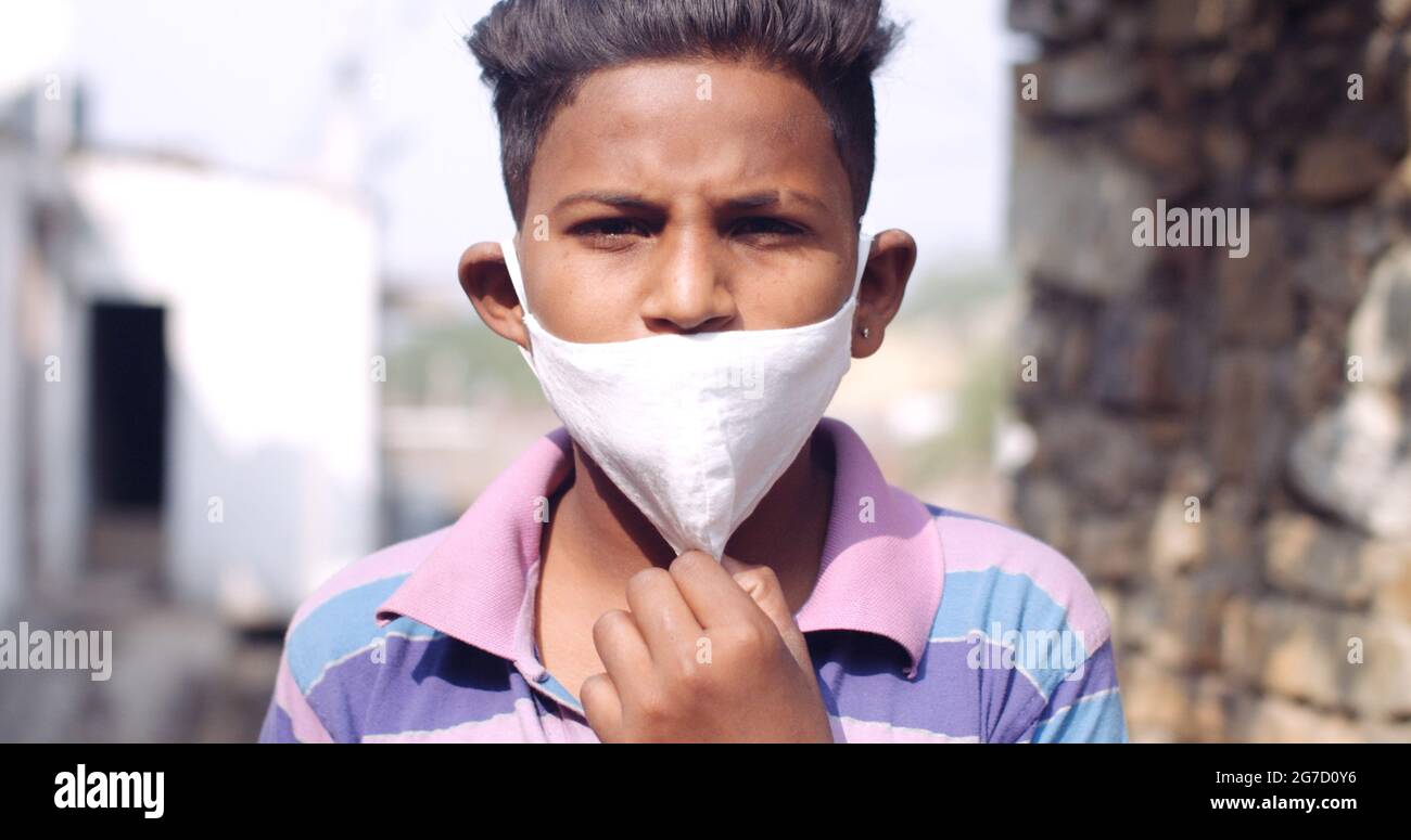 Closeup shot of an Indian boy wearing a mask- new normal concept Stock ...