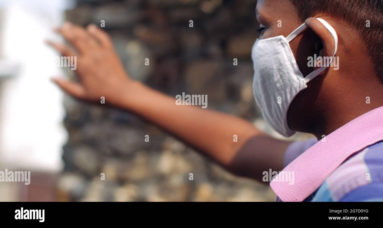 Closeup shot of an Indian boy wearing a mask- new normal concept Stock ...