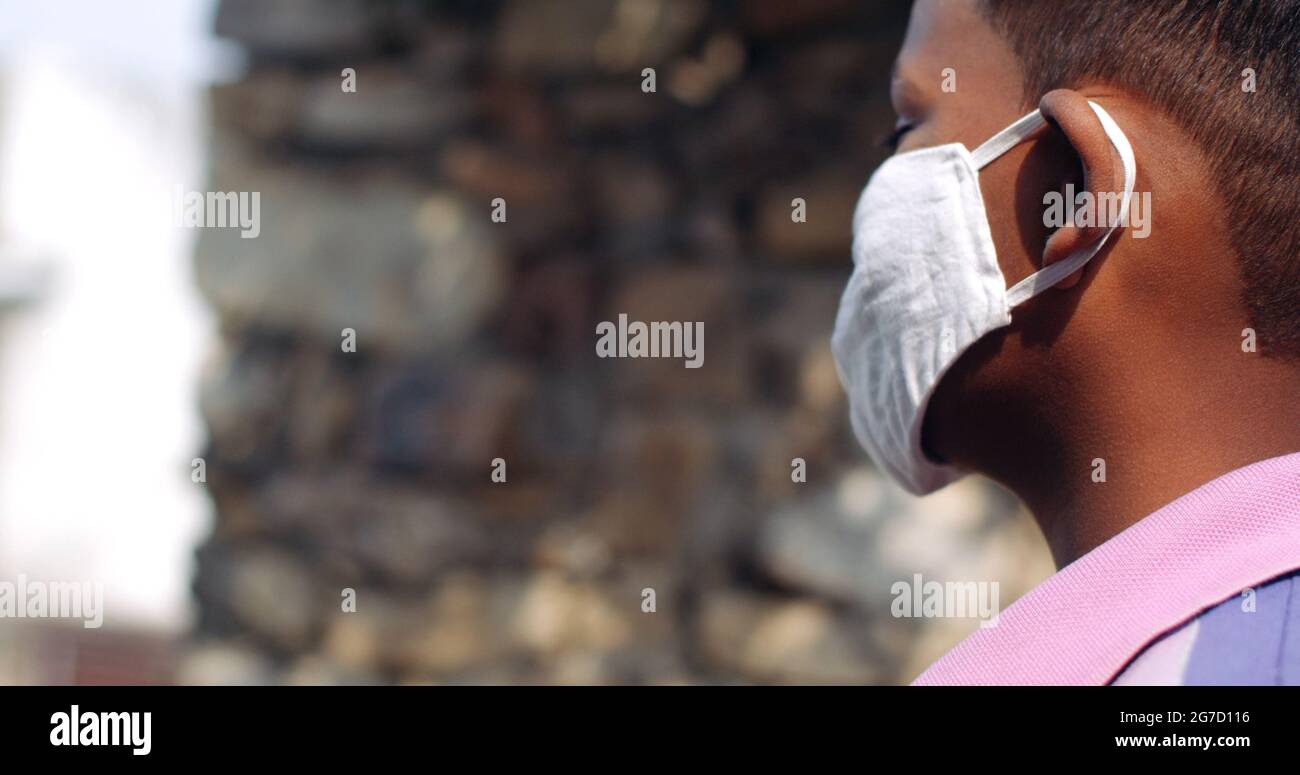 Closeup shot of an Indian boy wearing a mask- new normal concept Stock ...