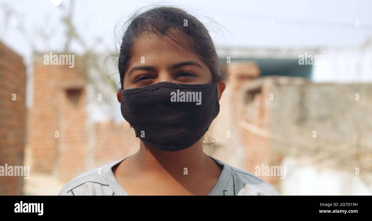 Closeup shot of an Indian girl wearing a mask- new normal concept Stock ...