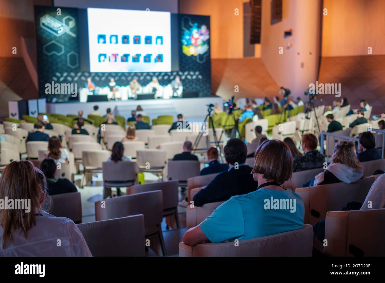 Business conference participants sitting in auditorium Stock Photo - Alamy