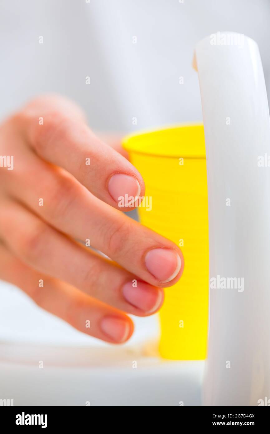 Patient rinse mouth with a cup of water at dentist Stock Photo - Alamy