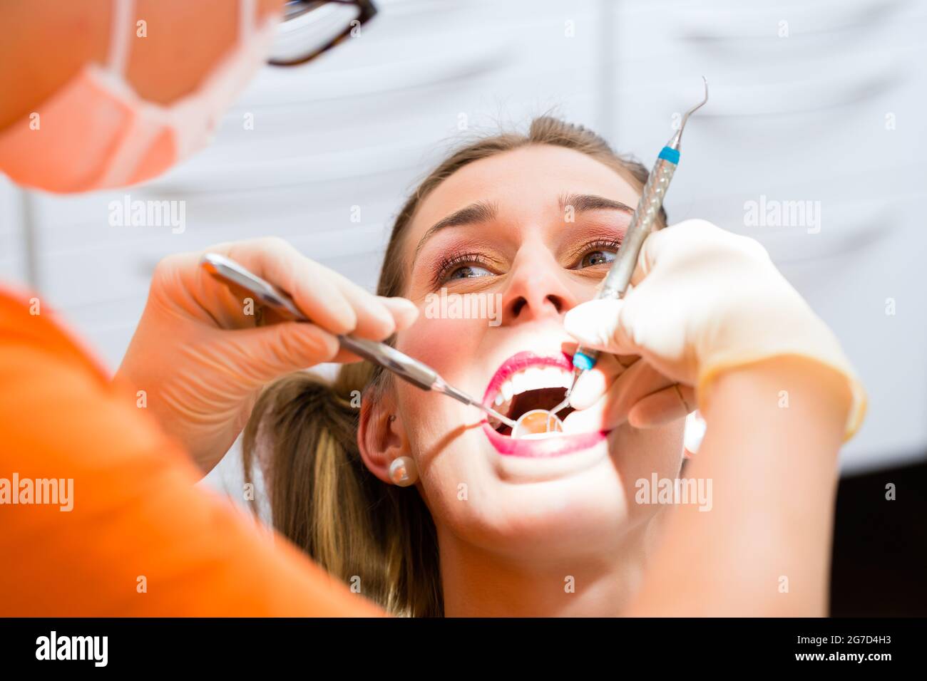 Patient having deep dental tooth cleaning at dentist Stock Photo - Alamy