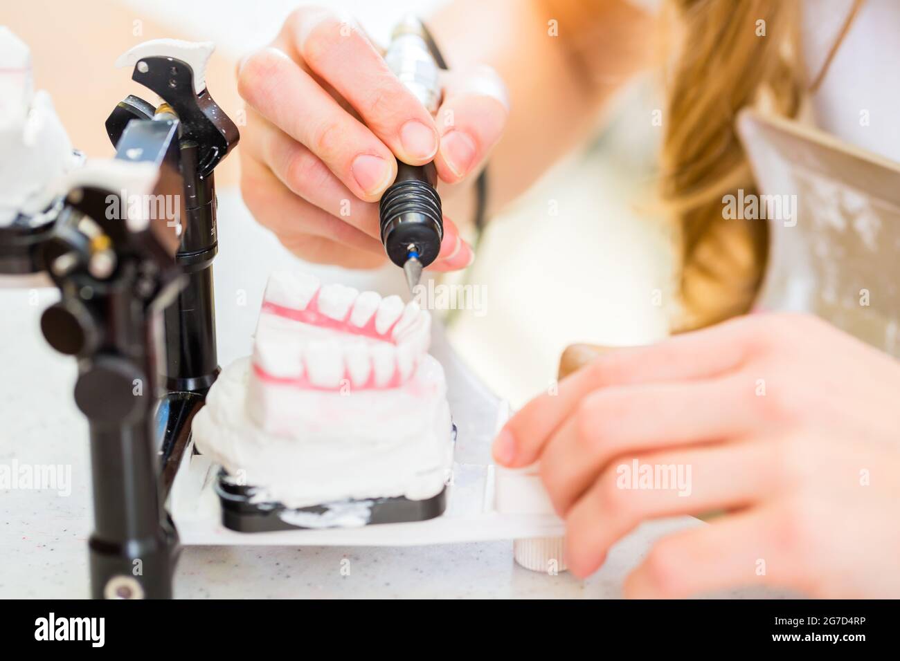 Dental technician producing denture Stock Photo - Alamy