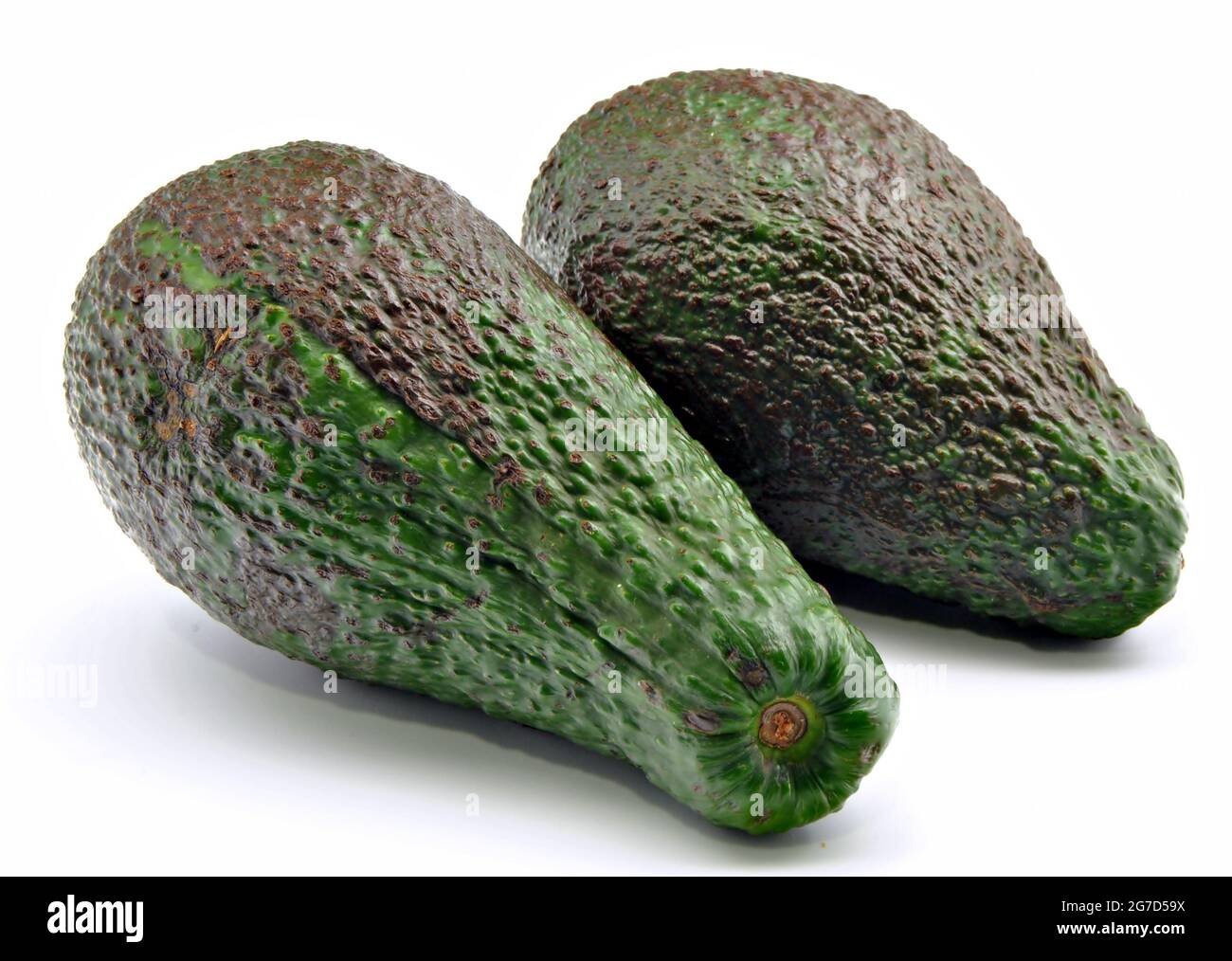 Top view of two long avocados with peels isolated on a white background ...