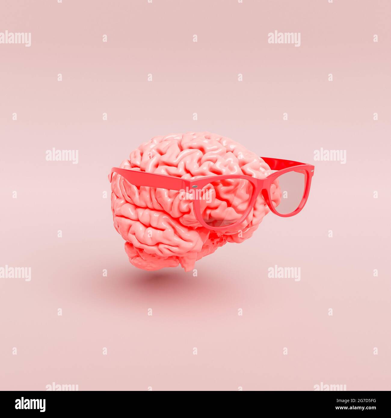 minimalistic scene of a brain with glasses in pastel red color. concept ...