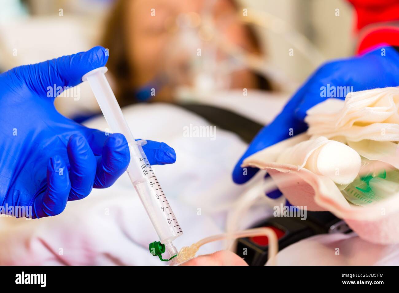 Ambulance Emergency doctor or paramedic medicate accident victim with ...