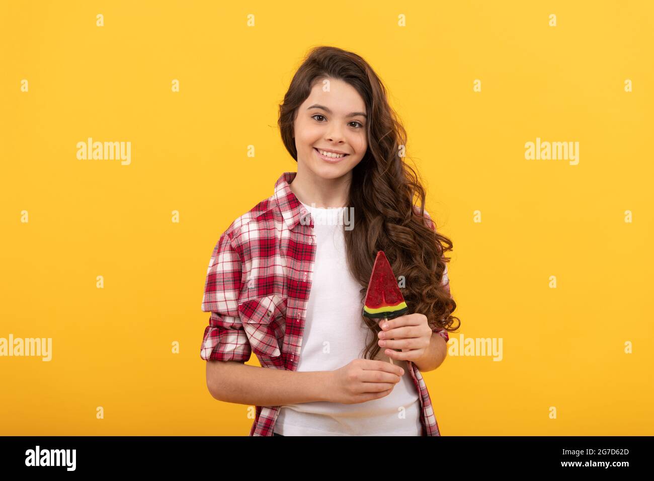 hipster kid with long curly hair hold lollypop. sugar candy on stick ...