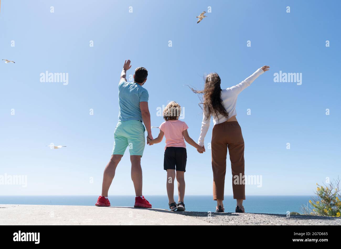 family of mother dad and child boy looking in future holding hands in ...