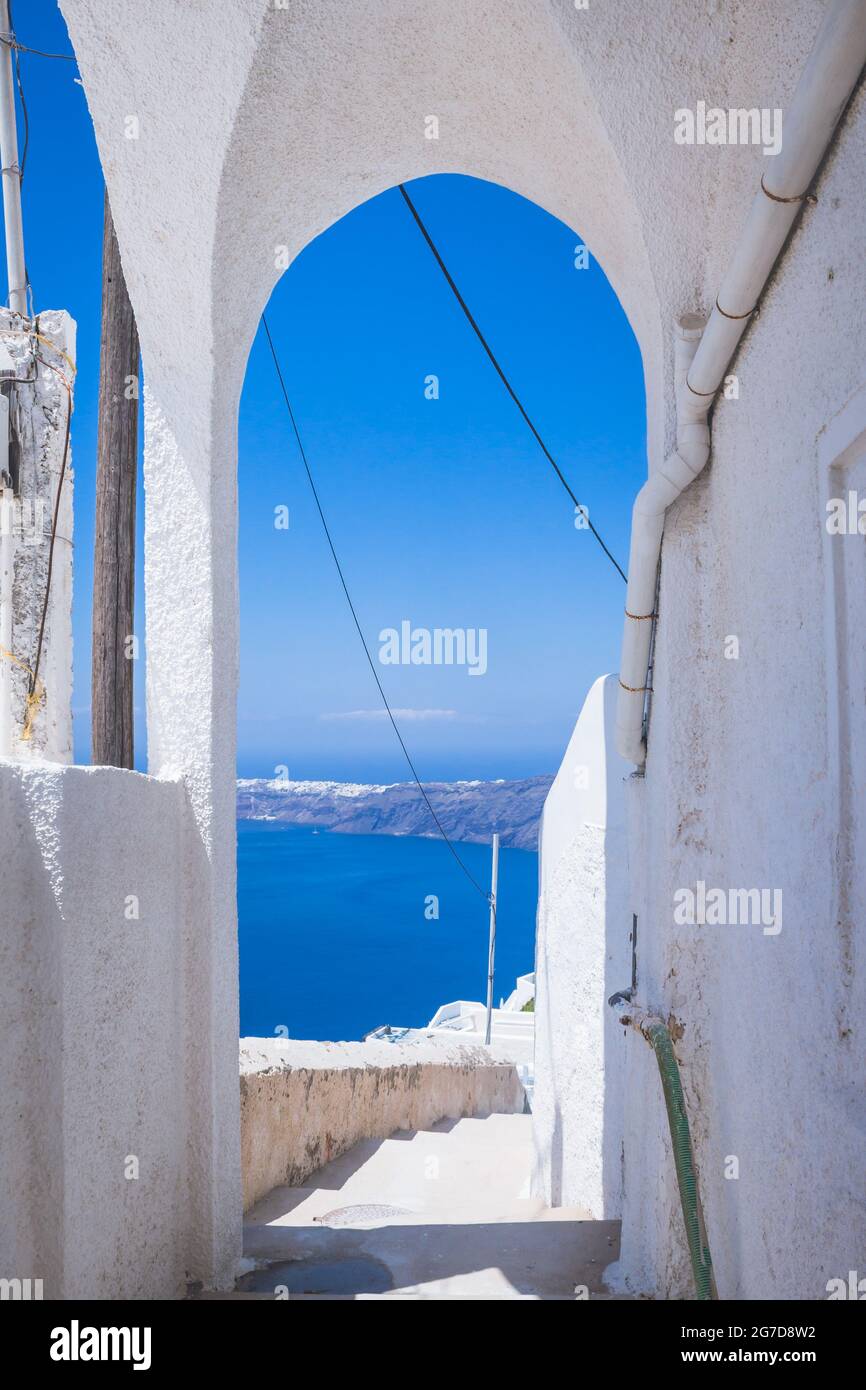 Beautiful Greek vista of the sea through a whitewashed archway in a ...