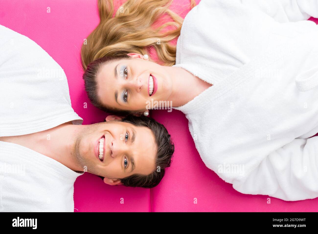 Couple relaxing in relaxation room on lounger of wellness spa Stock ...