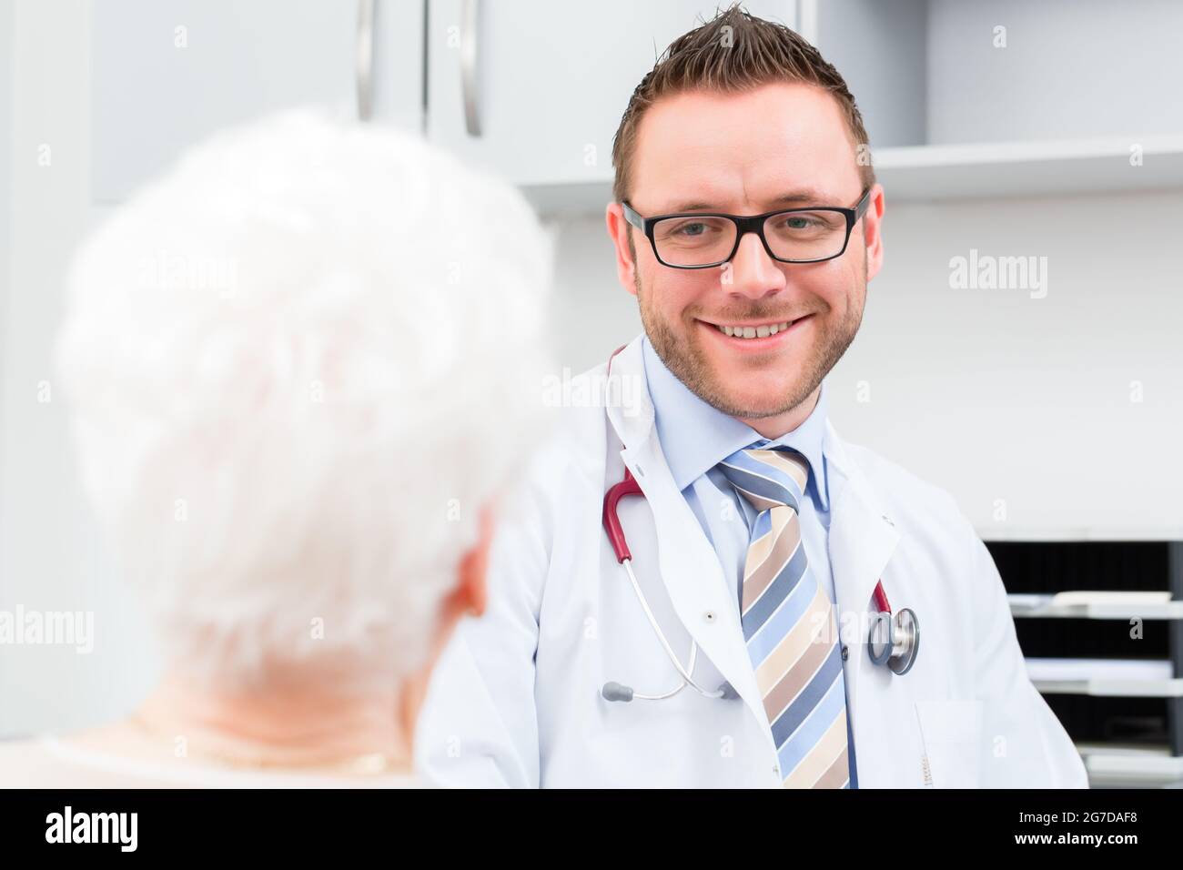 Man seeing doctor hi-res stock photography and images - Alamy