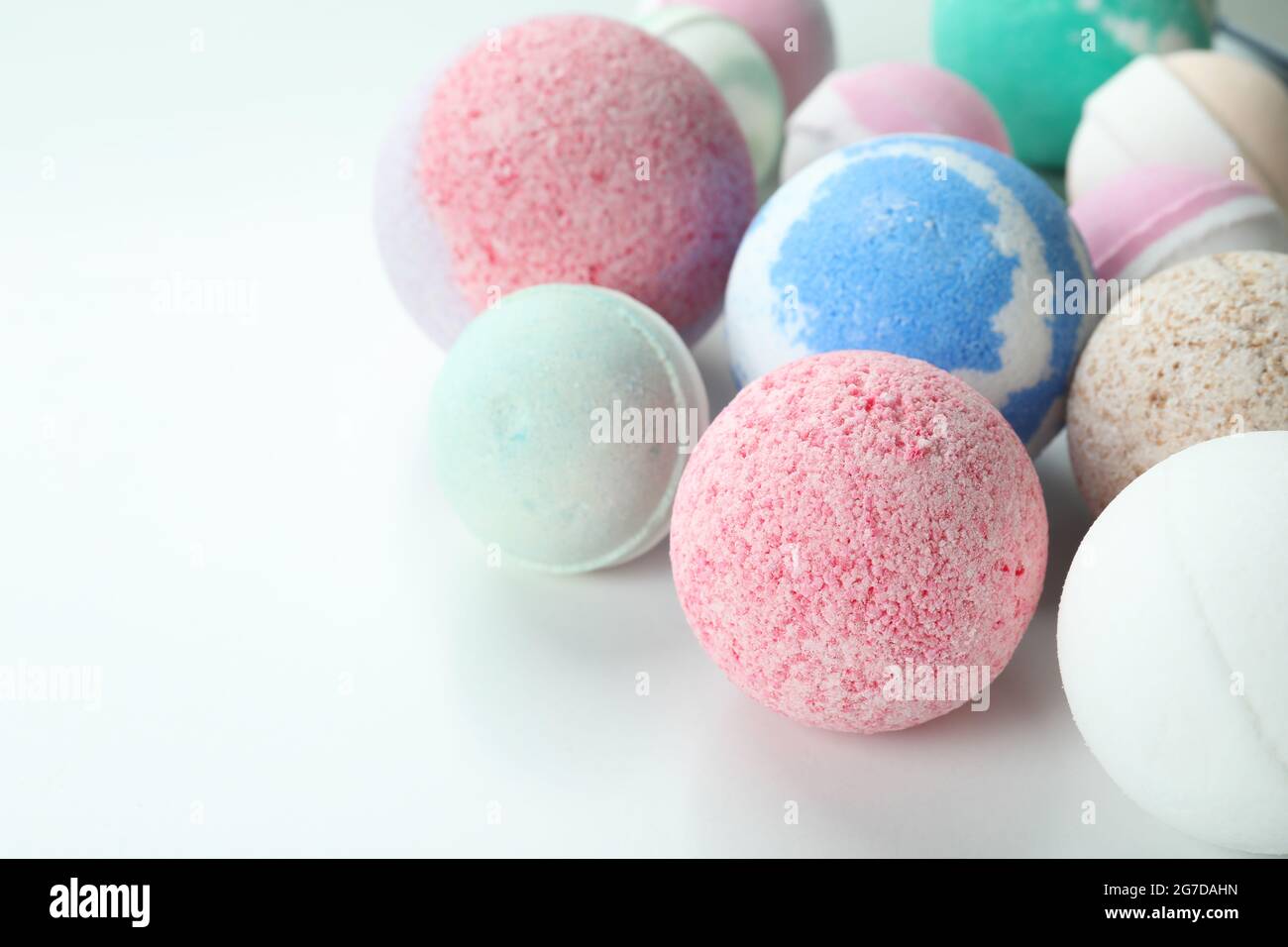 Different bath balls on white background, close up Stock Photo - Alamy