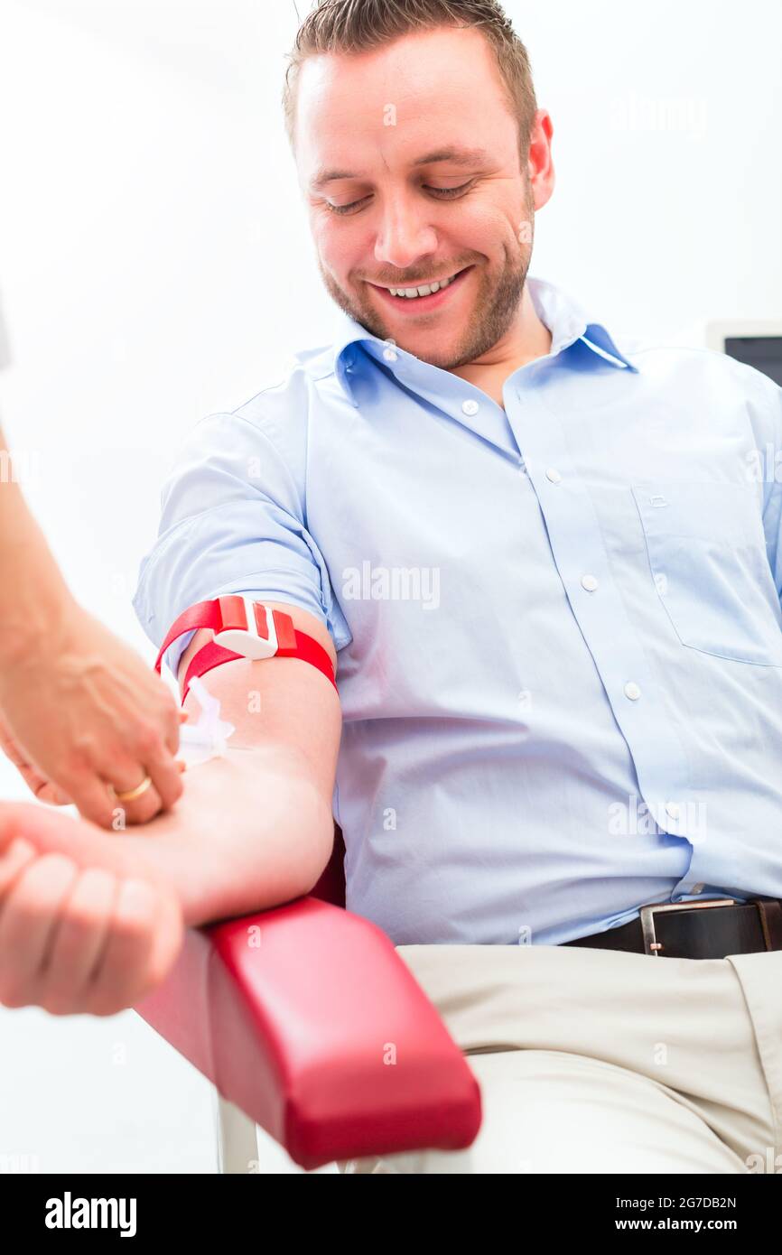 Female doctor or nurse taking blood sample from patient Stock Photo - Alamy