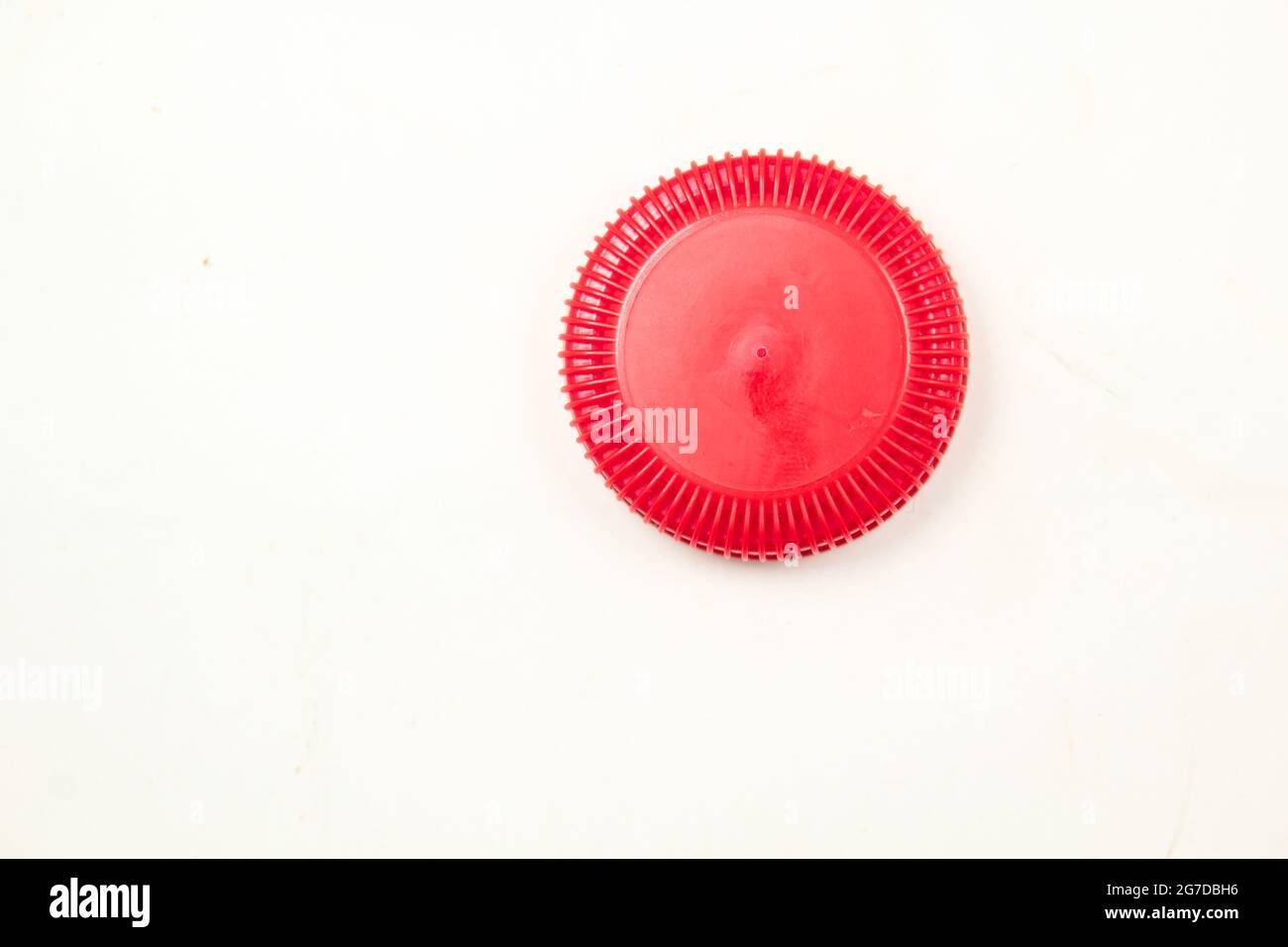 Red colour bottle cap on isolated white surface Stock Photo - Alamy