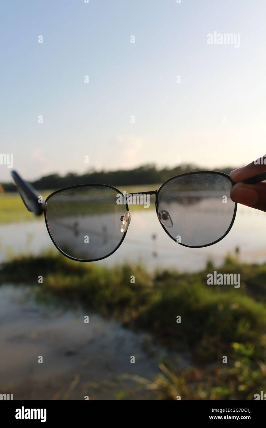 Sunglass on hand, stylish sunglass Stock Photo - Alamy