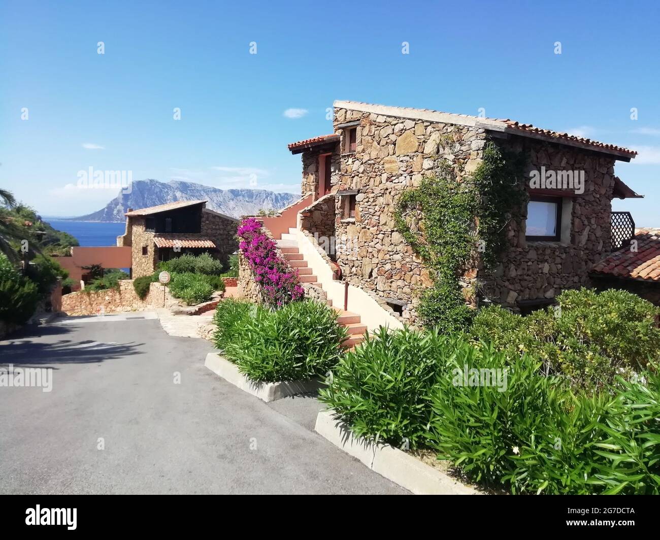 Buildings of Capo Coda Cavallo village on the island of Sardinia in ...