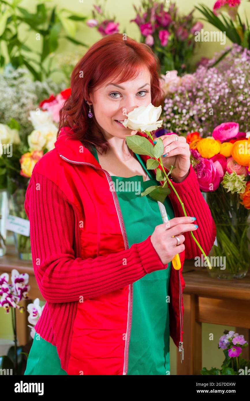 Caucasian florist selling bouquets hi-res stock photography and images ...