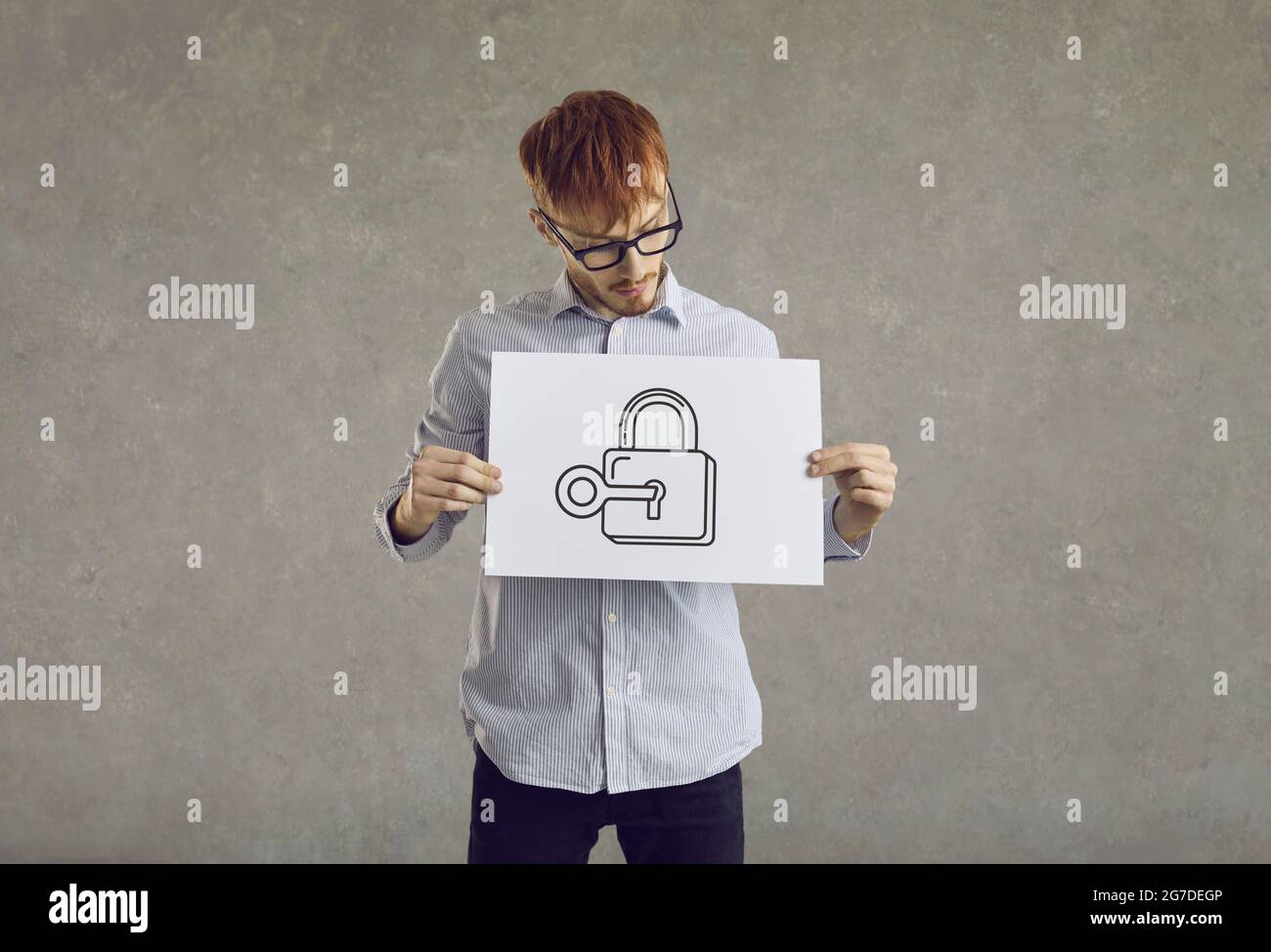 Man holding picture of key opening door lock and getting access to ...