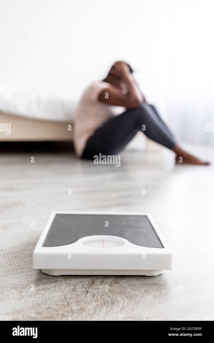 Scales depressed overweight woman hi-res stock photography and images ...