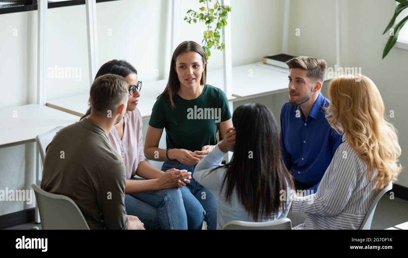Diverse team discussing mental health problems on group therapy meeting ...
