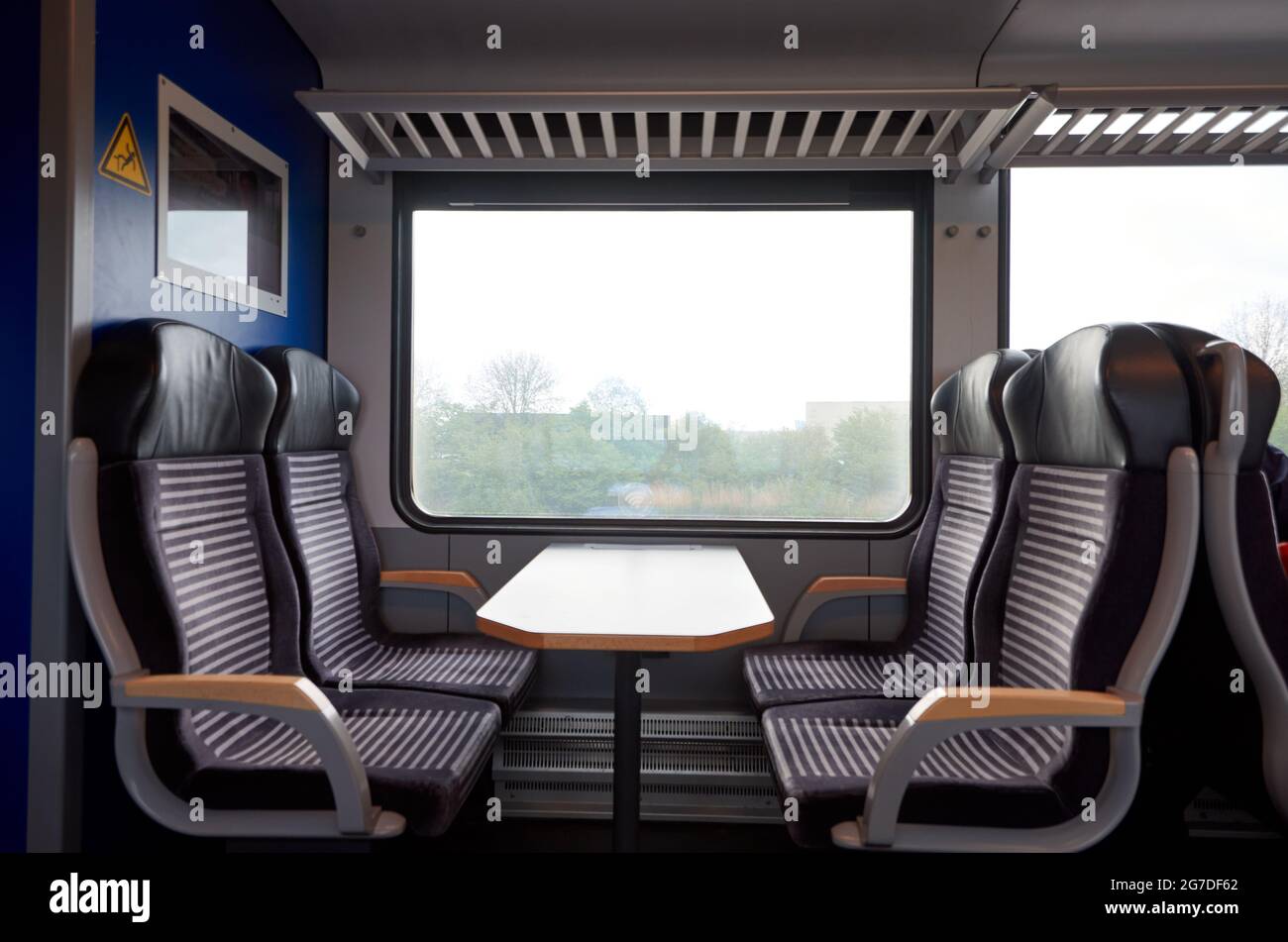 Interior of a modern equipped train on the rails in the daylight Stock ...