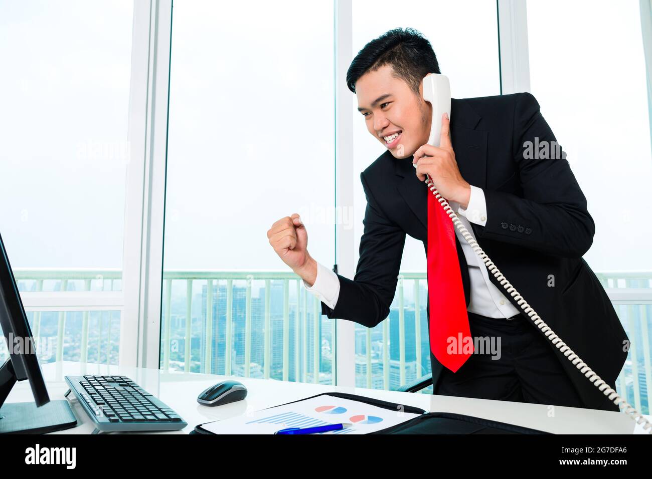 Asian business man telephoning in office controlling profit Stock Photo ...
