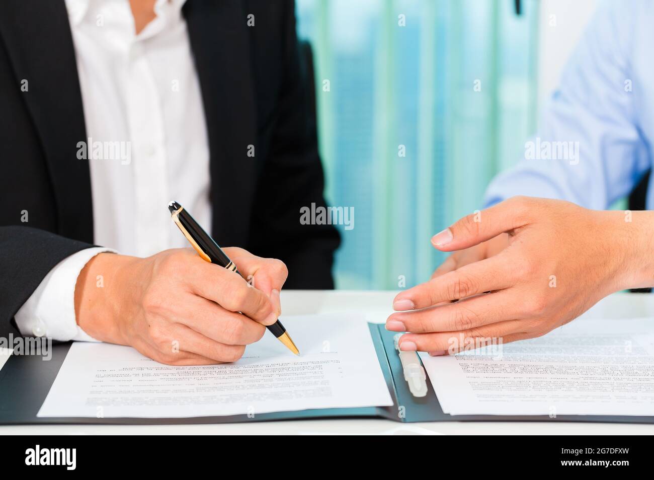 business people signing agreement in office Stock Photo - Alamy