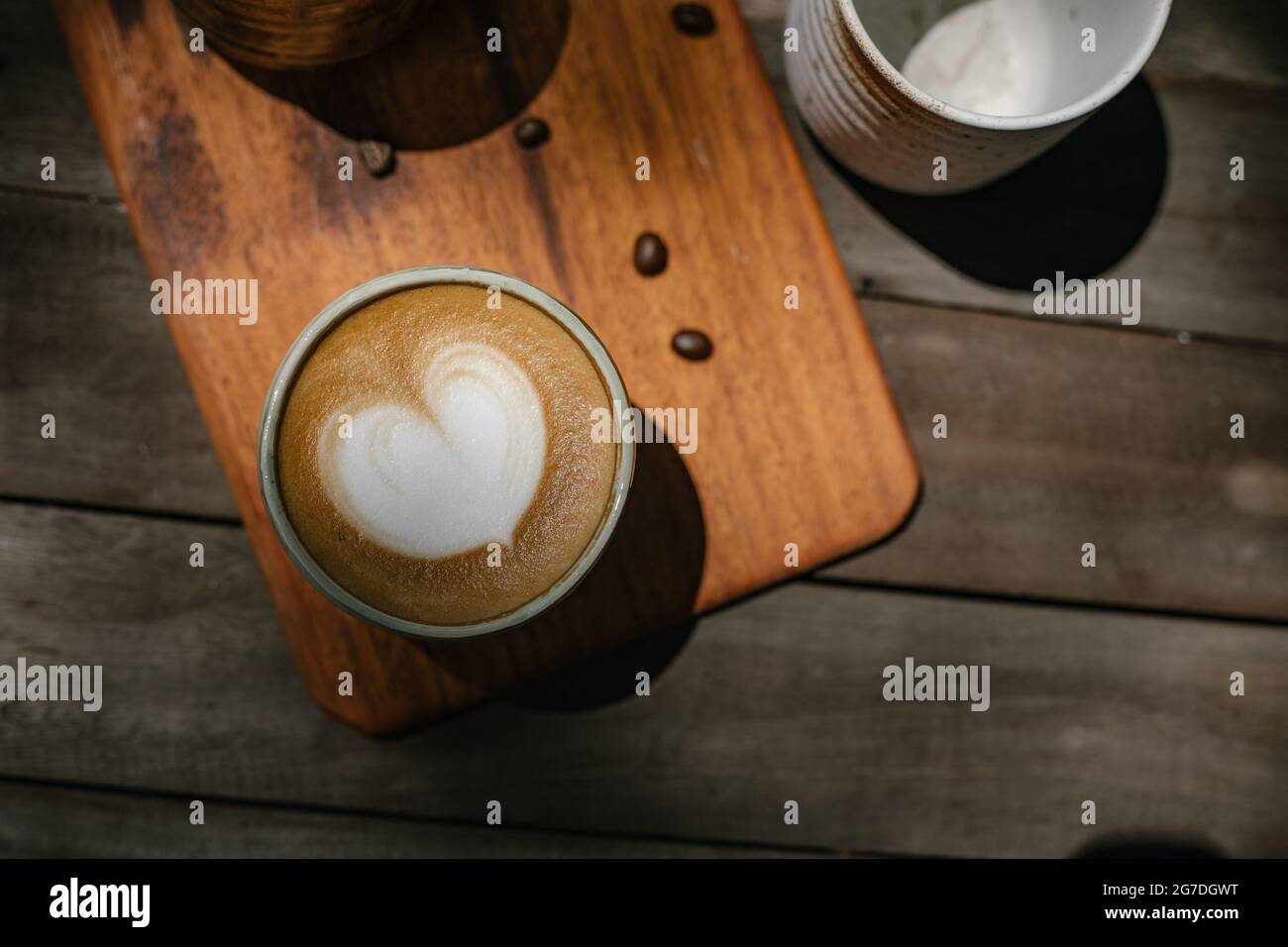 Selective focus cup of hot latte art coffee on wooden table,focus at ...