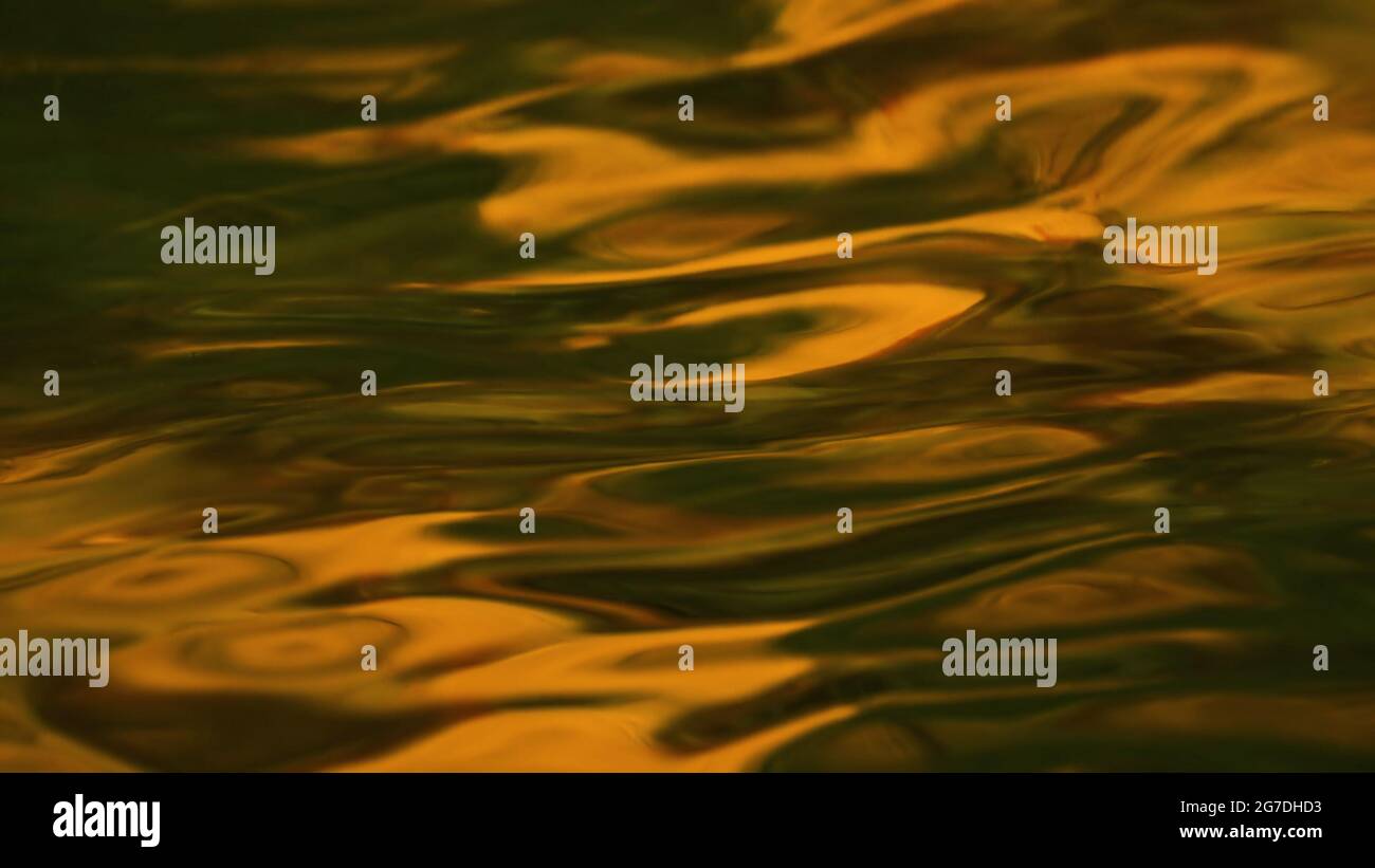 3D rendering of a bright abstract colored liquid metal alloy spreading ...