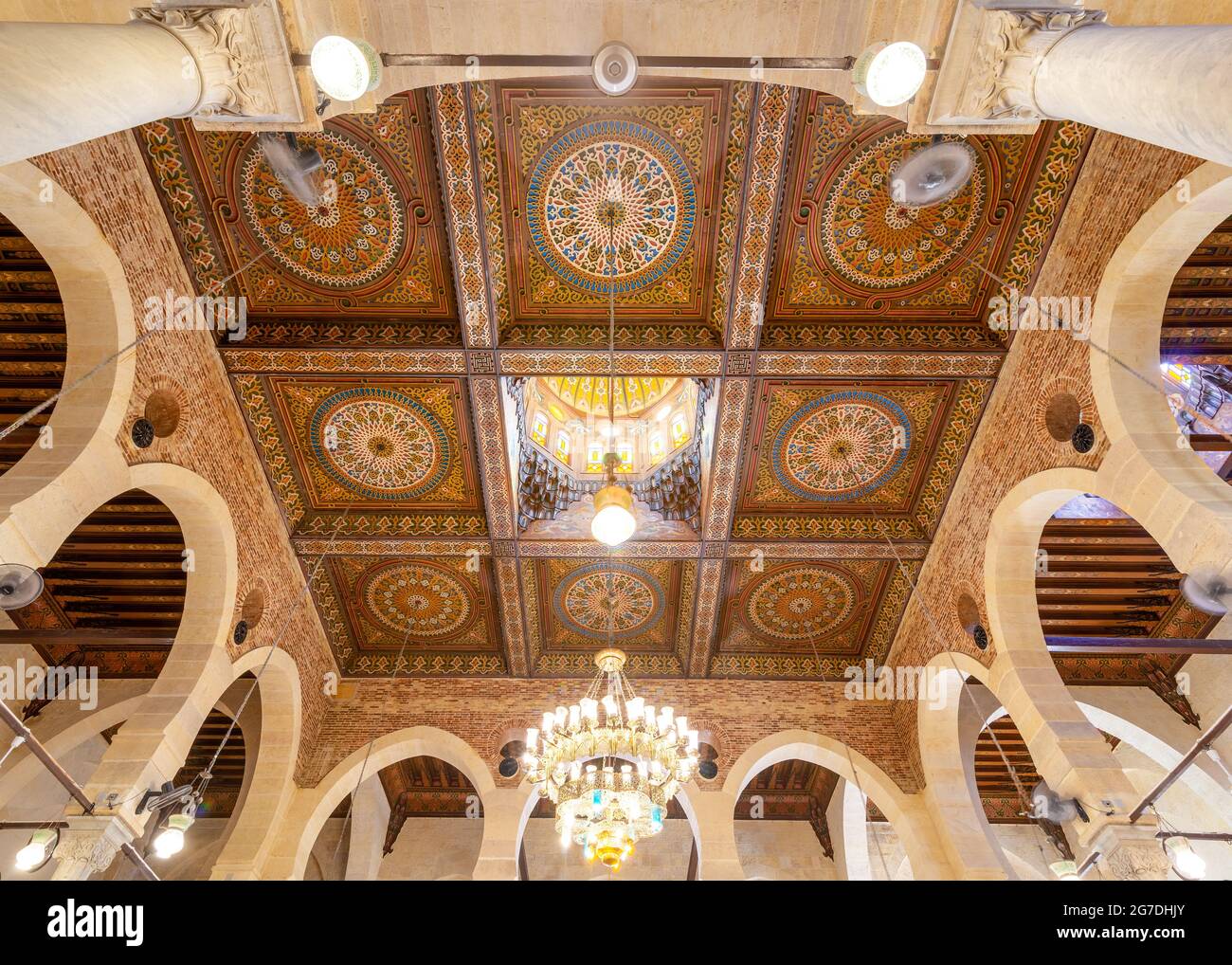 Wooden ceiling decorated with colorful floral patterns and dome at ...
